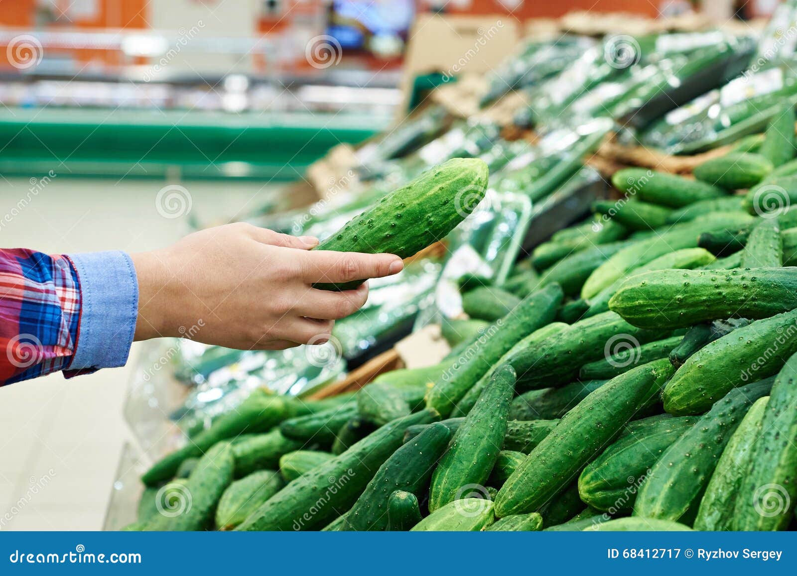 Buyer Selects Cucumber in Store Stock Image - Image of green, eating ...