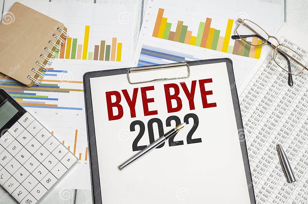BYE BYE 2022 . Conceptual Background with Chart ,papers and Pen Stock ...
