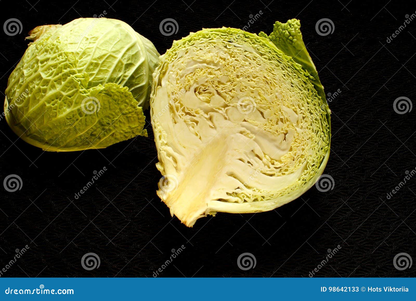 Cabbage Cut in Half on a Black Surface Stock Image - Image of fresh ...