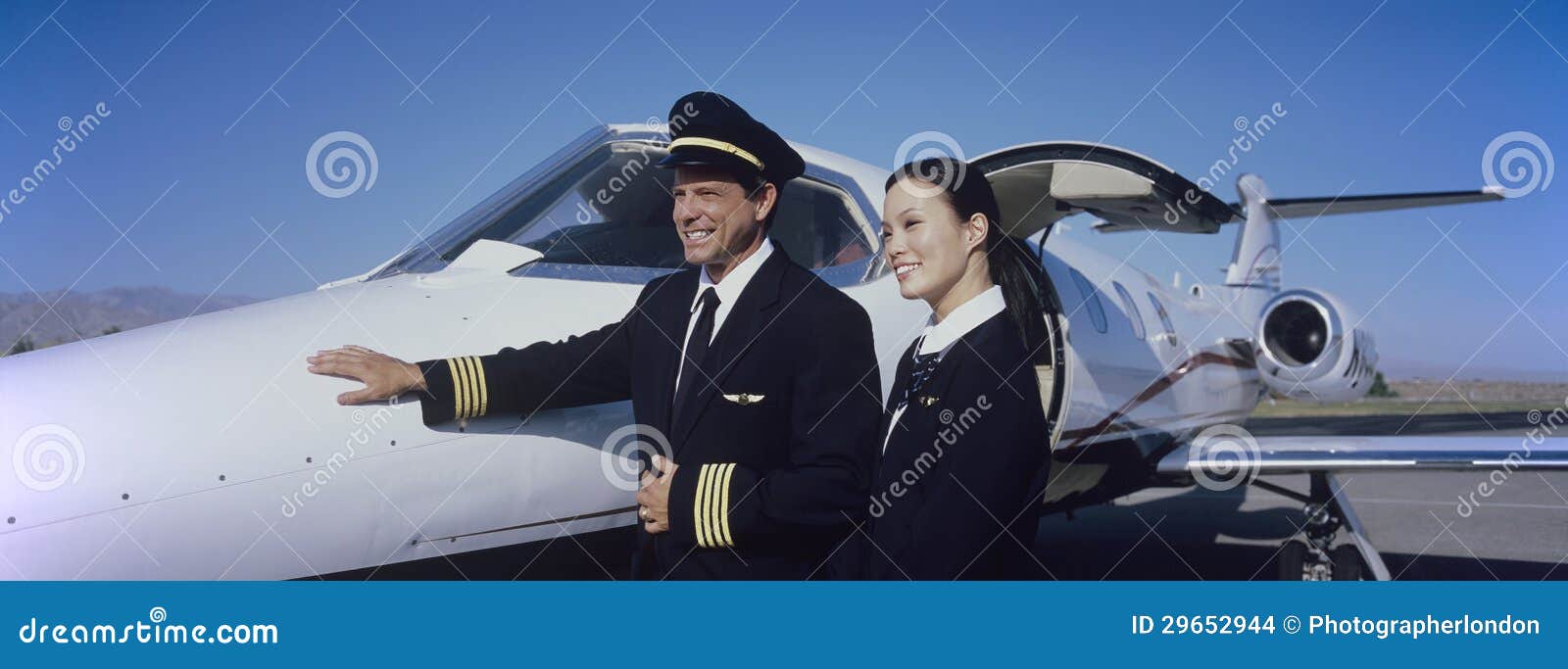 Cabin Crew Members By An Aircraft Stock Photo - Image: 29652944