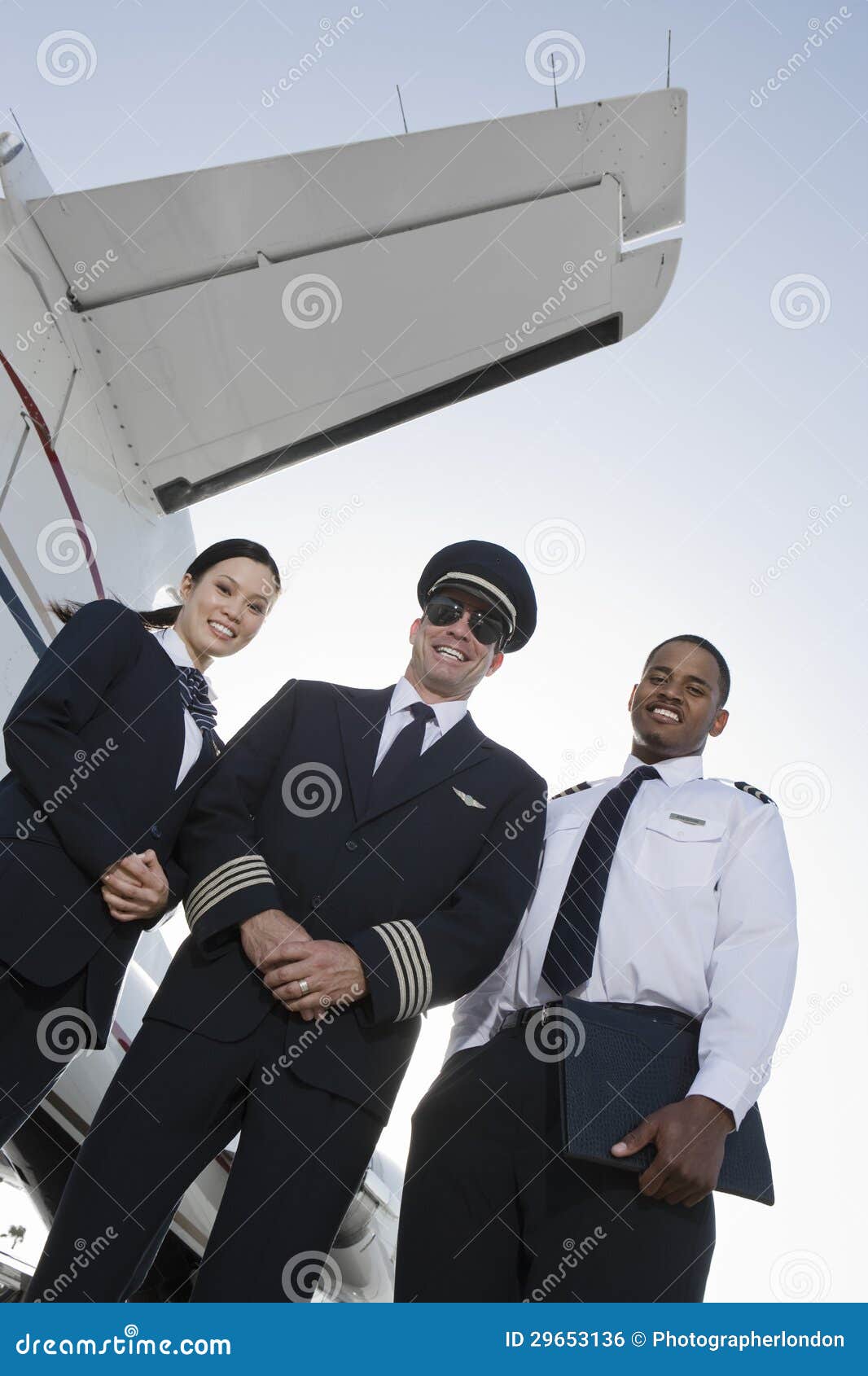 Cabin Crew Members Standing Together At Airfield Stock Photography ...