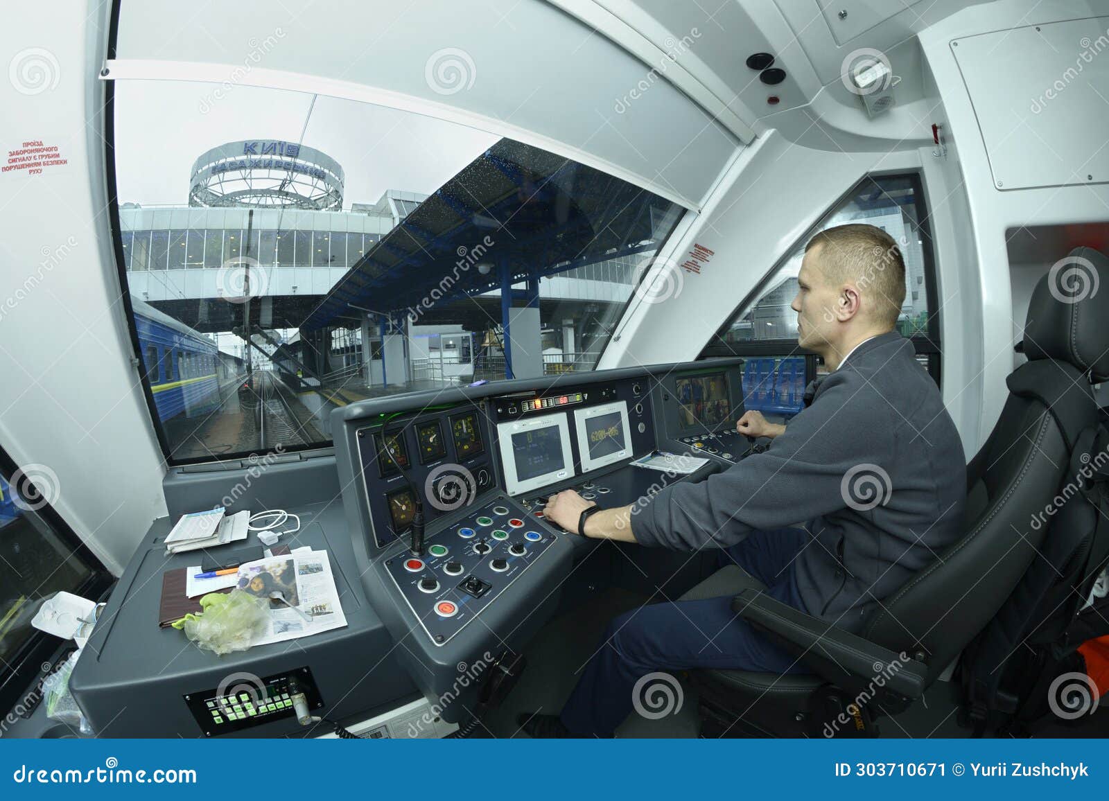 At the Cabin of the Passenger Train. Train Driver Sitting in Front of ...