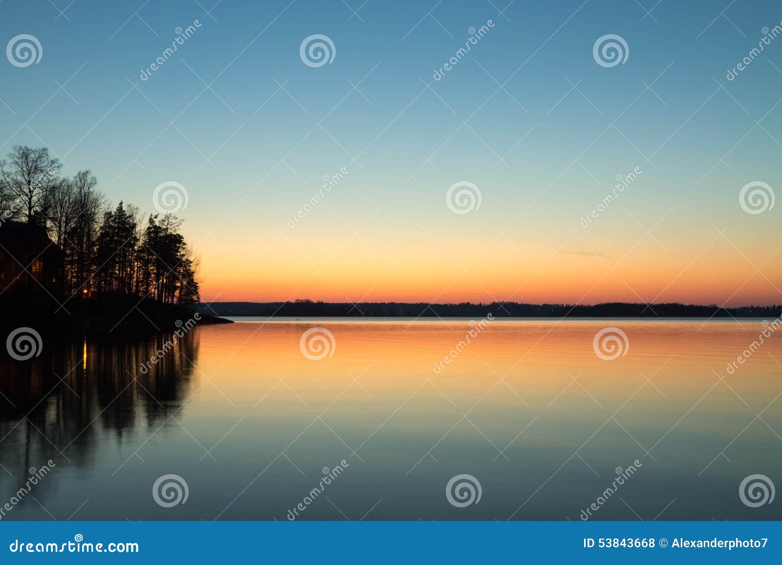 Cabin on the Point Reflecting in the Lake with Spring Sunset Stock ...