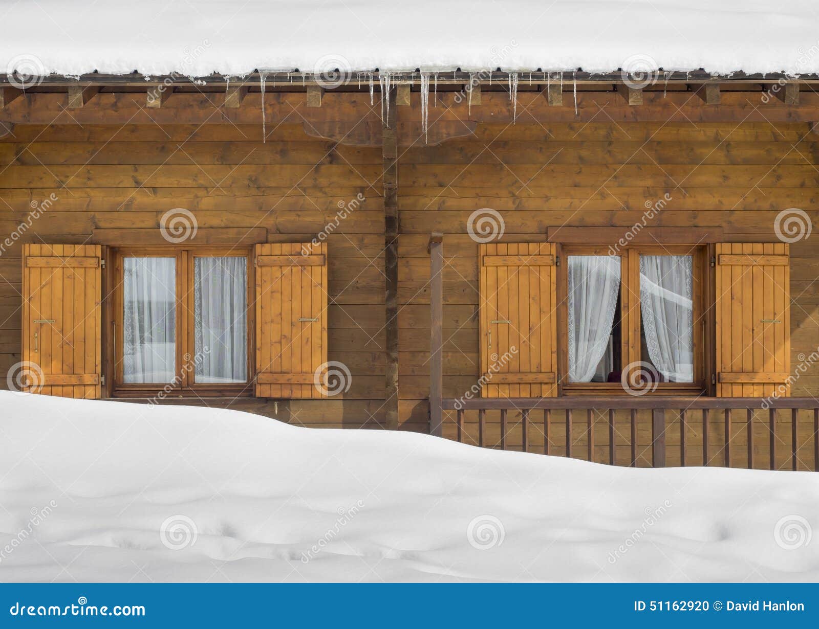 Cabin Windows Behind Snow Drift Stock Photo - Image of wood, cosy: 51162920