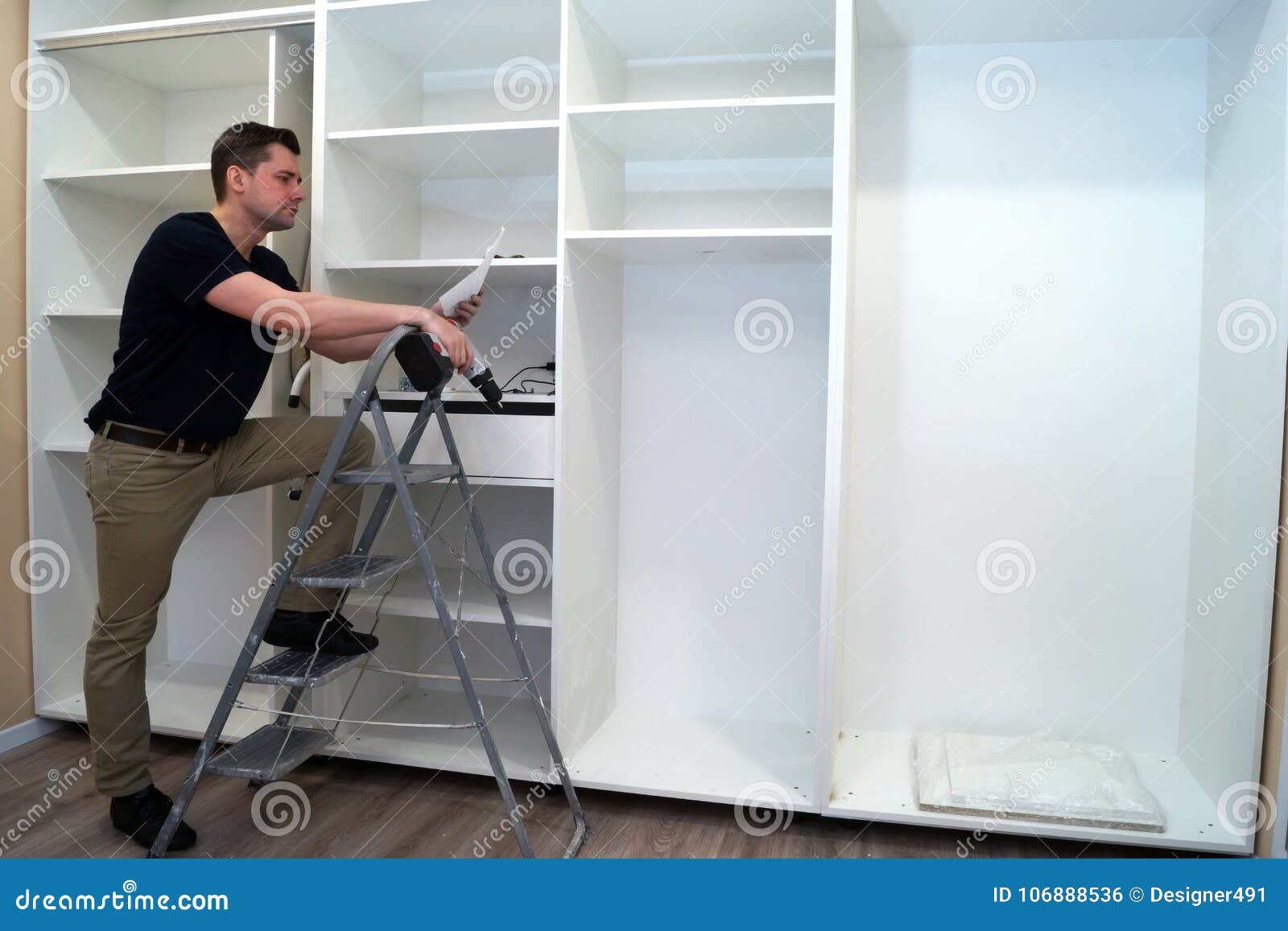 Cabinet Master Reading a Scheme of Cupboard. Stock Photo - Image of ...