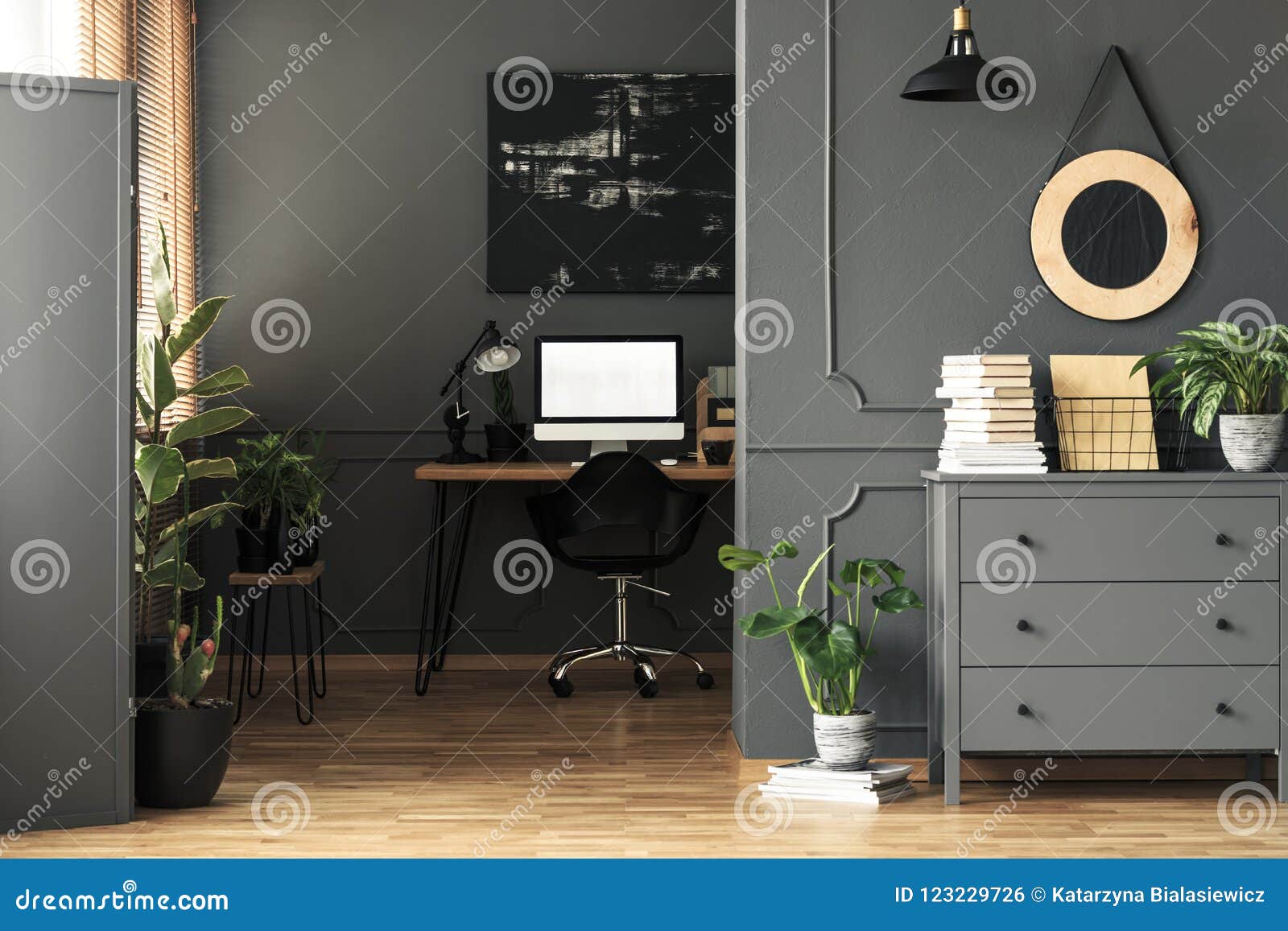 Cabinet and Plants in Grey Workspace Interior with Mockup Screen Stock ...