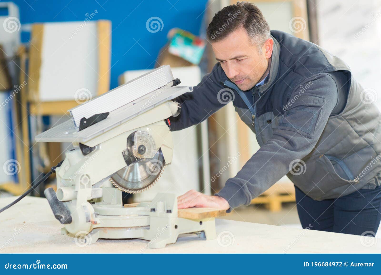 Cabinetry Worker Using Drop Saw To Cut Plank Stock Photo - Image of ...