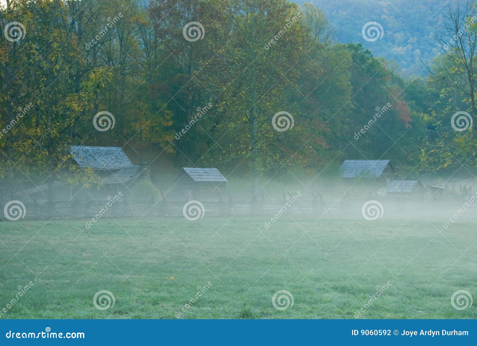 Cabins in the Autumn mist stock photo. Image of peaceful - 9060592