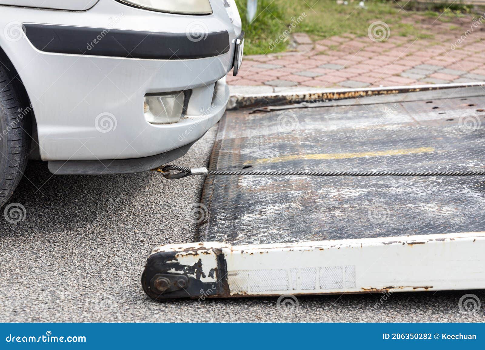 Cable Attached To Broken Down Car Being Pulled Onto Tow Truck Stock ...