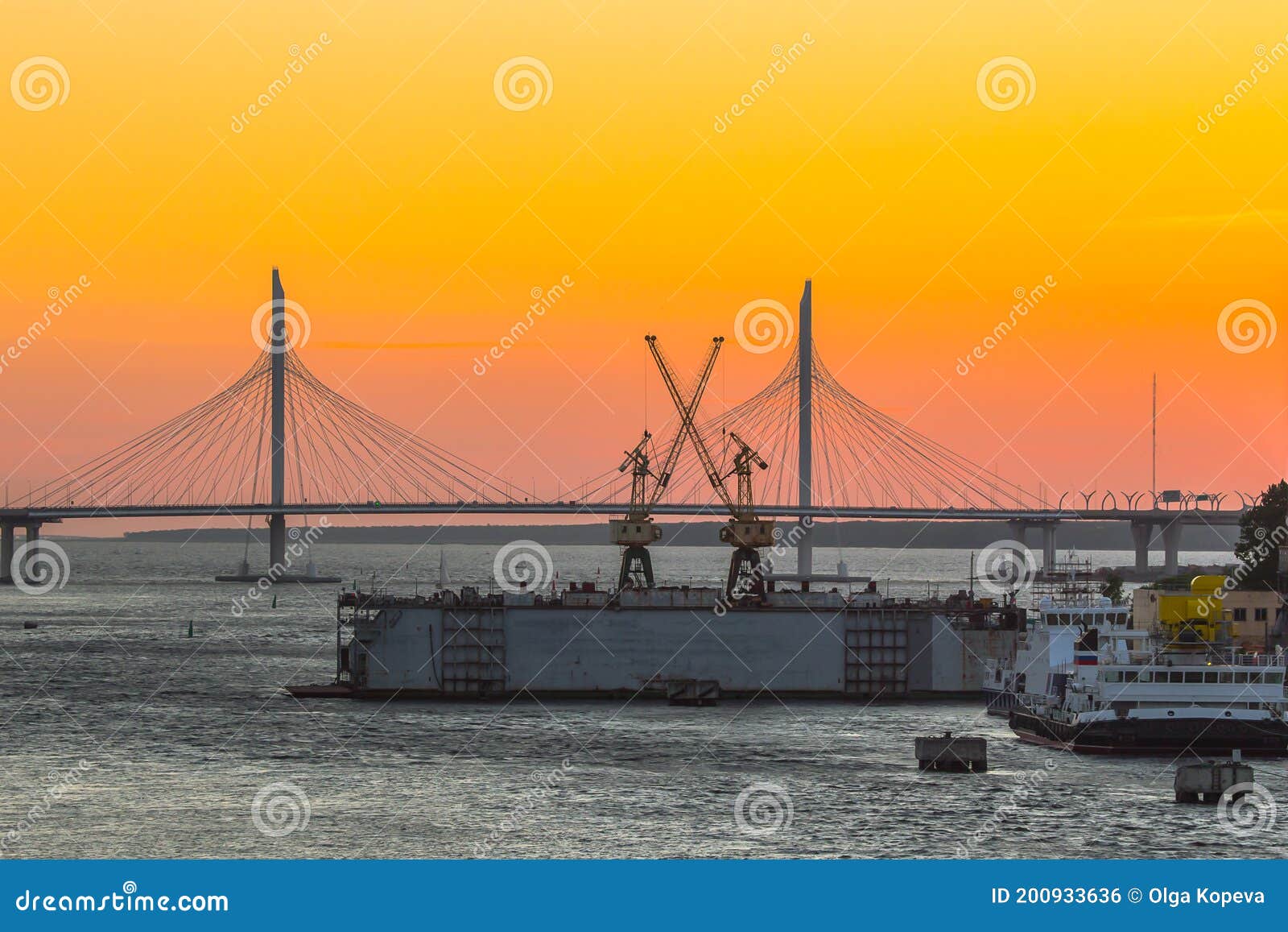 Cable-stayed Bridge Over the River and Floating Dock at Sunset Stock ...