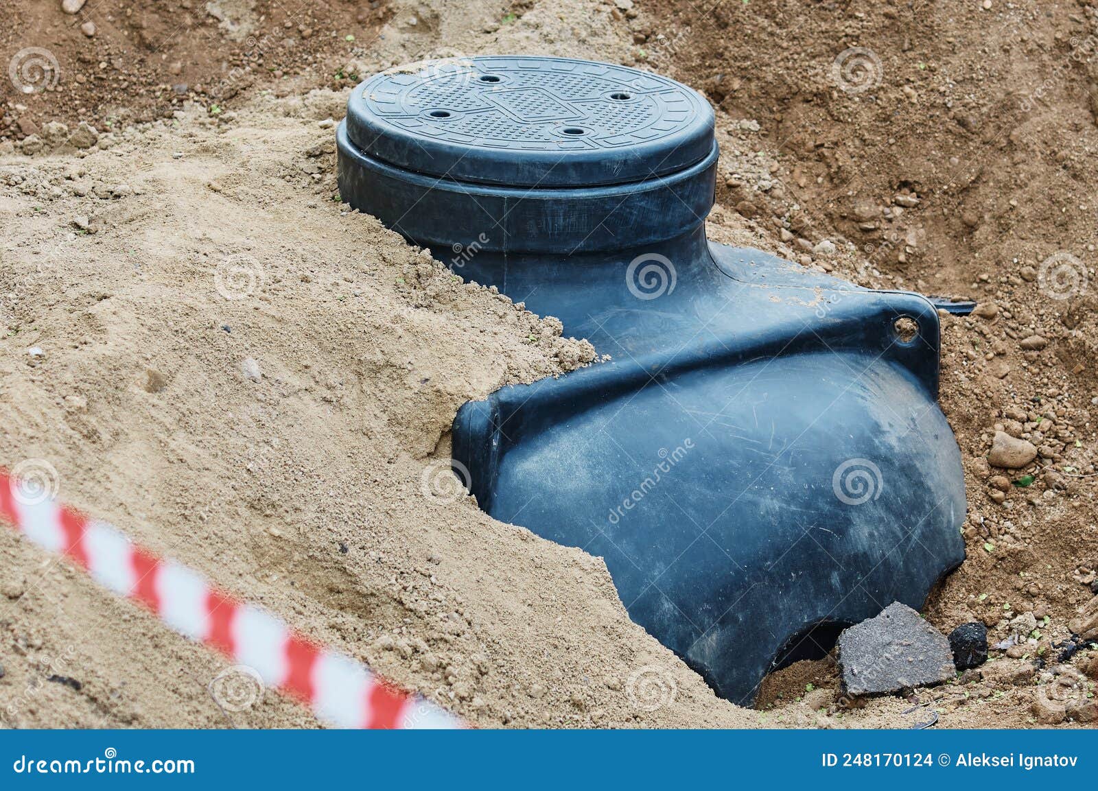 A Cable Underground Well is Installed in a Pit and Sprinkled with Sand ...