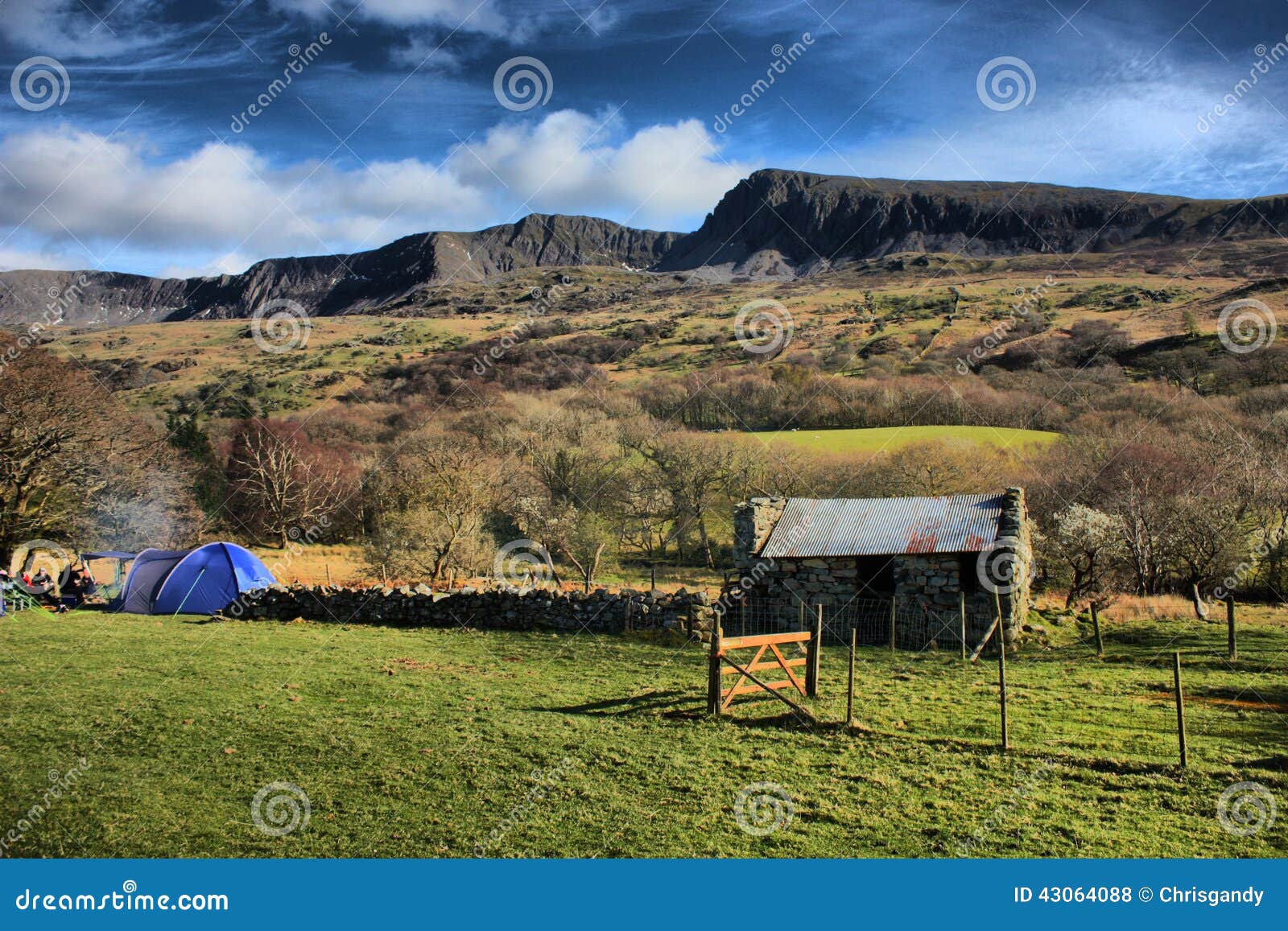 Cadair Idris Behind A Mountain Lake Bathed In Sunshine In Snowdonia ...