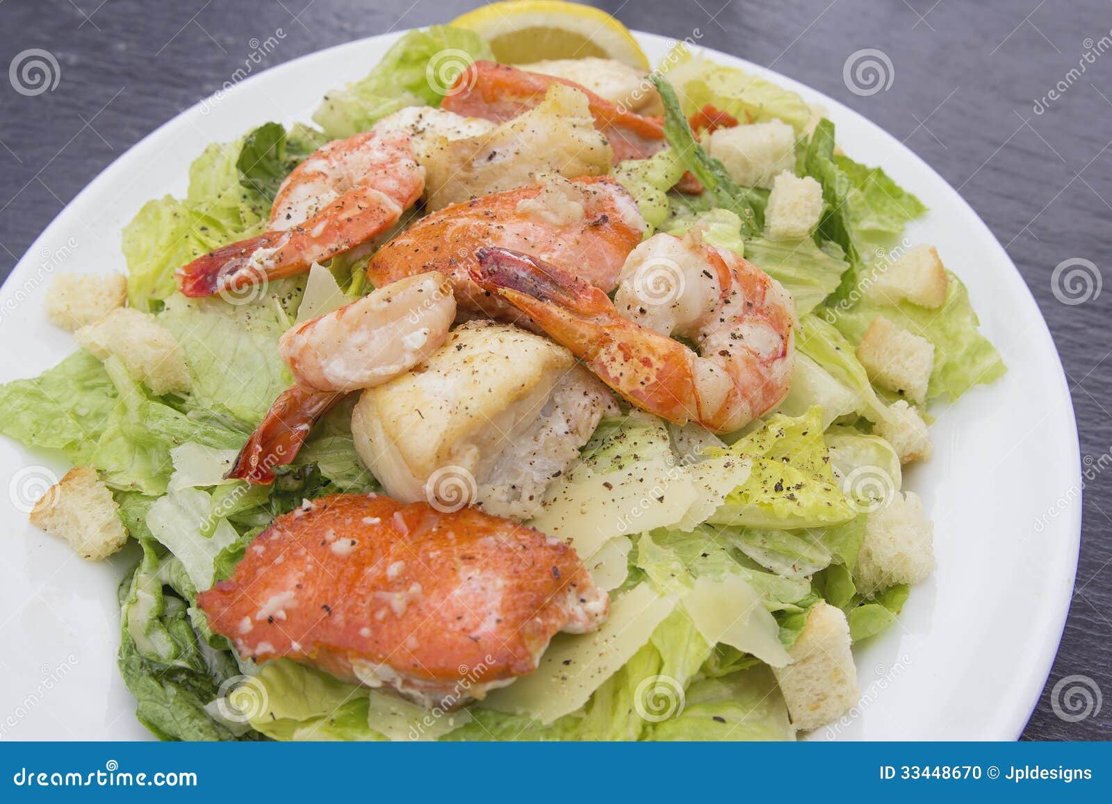 Caesar Salad with Prawns Salmon and White Fish Closeup Stock Photo ...