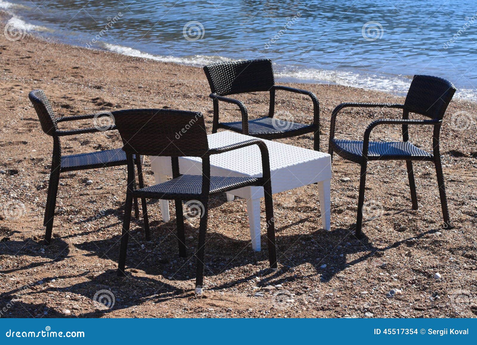 Cafe on the Beach: Wicker Table and Chairs by the Sea. Stock Photo ...