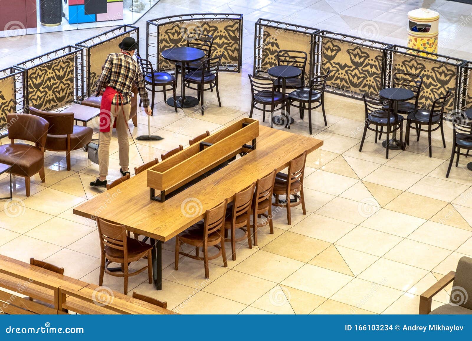 Cafe Cleaning at the End of the Working Day. Sweeping Debris and Wet ...