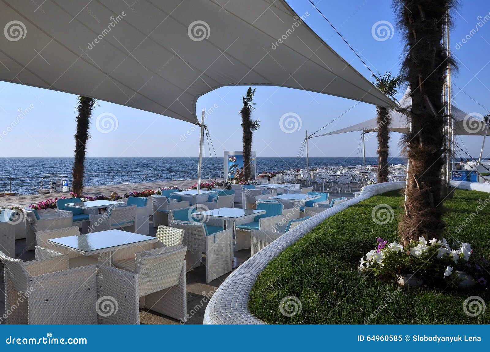 Cafes on the waterfront stock image. Image of blooming - 64960585