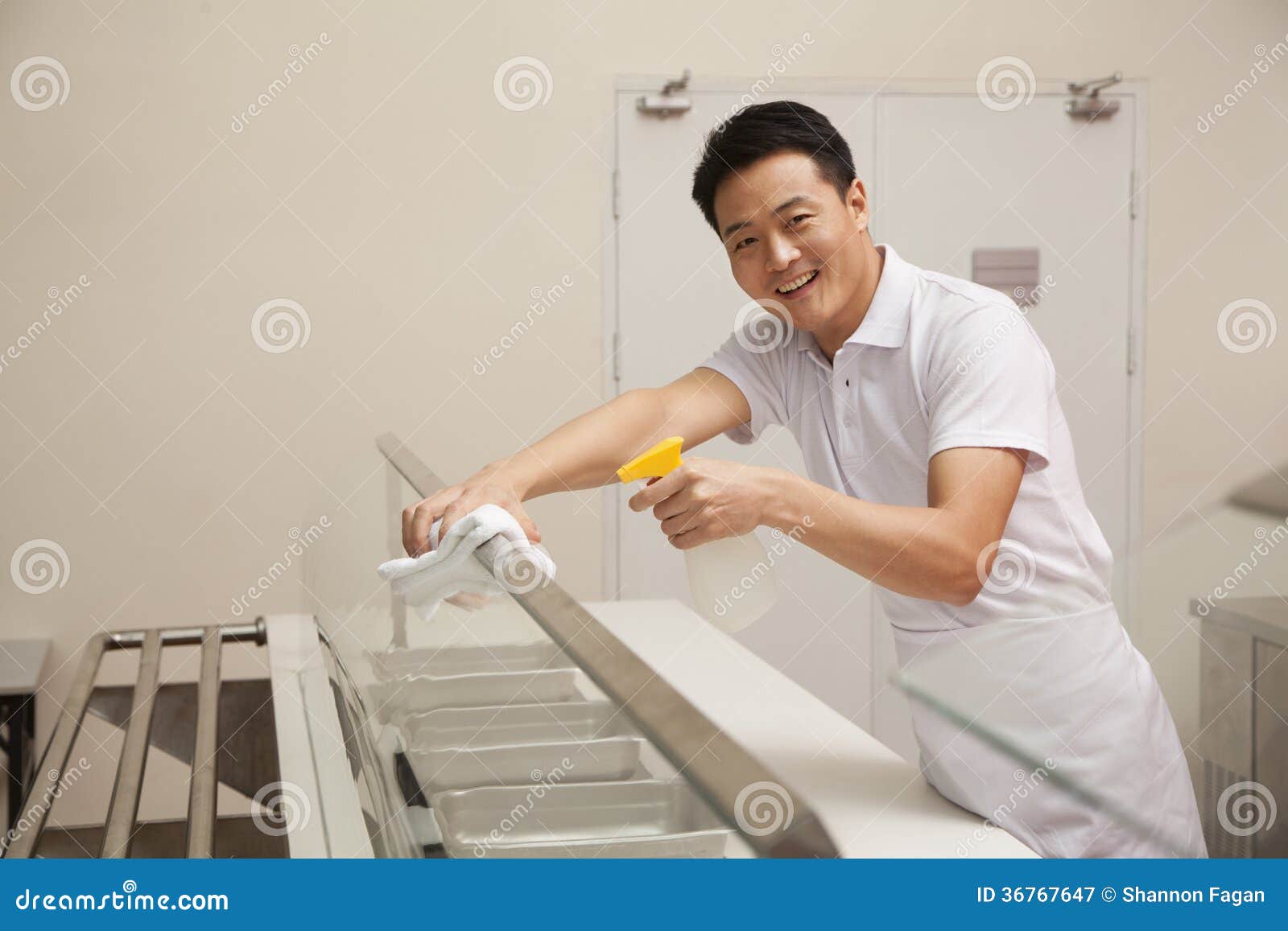 Cafeteria Worker Cleaning Food Serving Area Stock Image - Image of ...