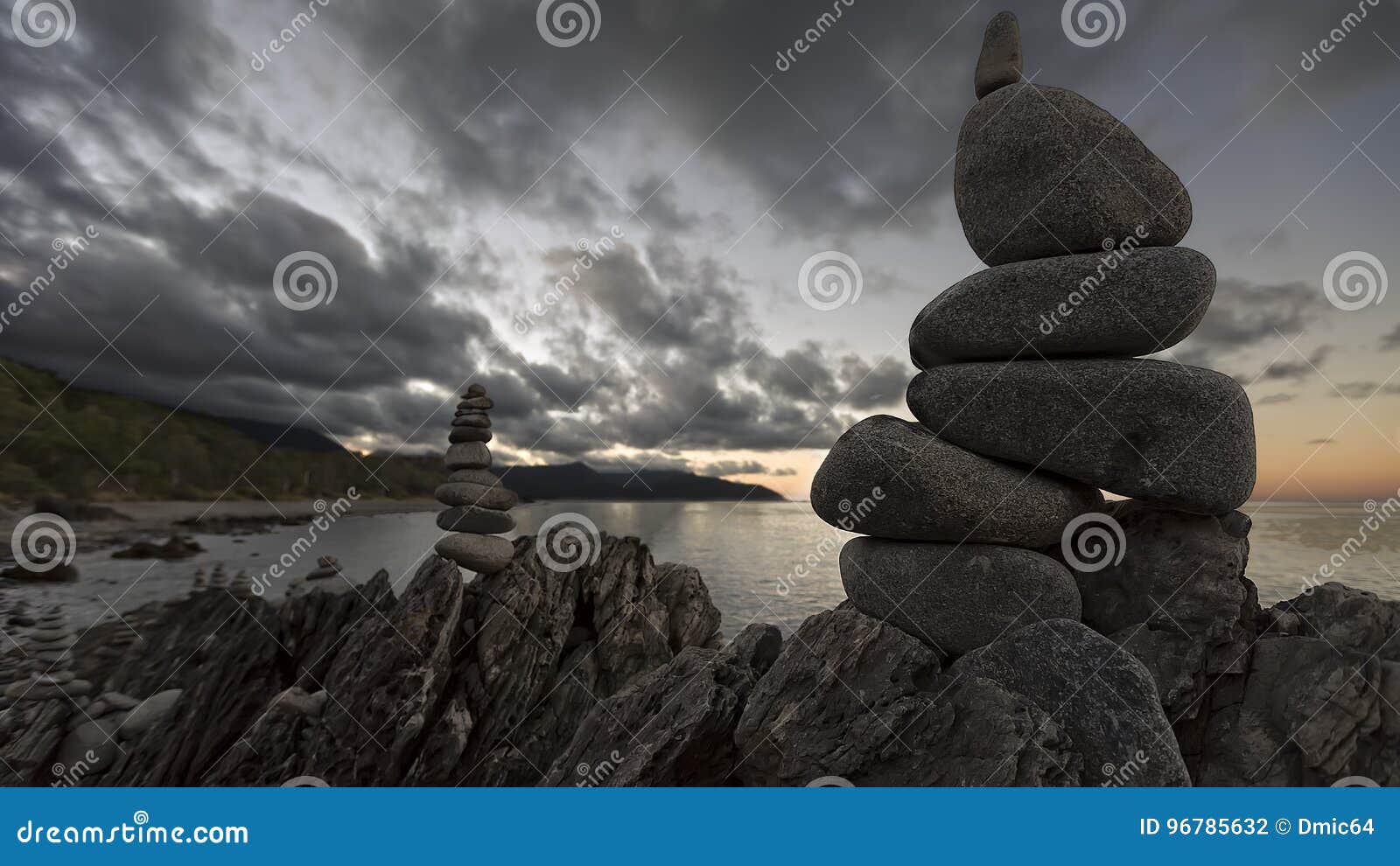 Cairns in Cairns stock photo. Image of sunset, rock, cairns - 96785632