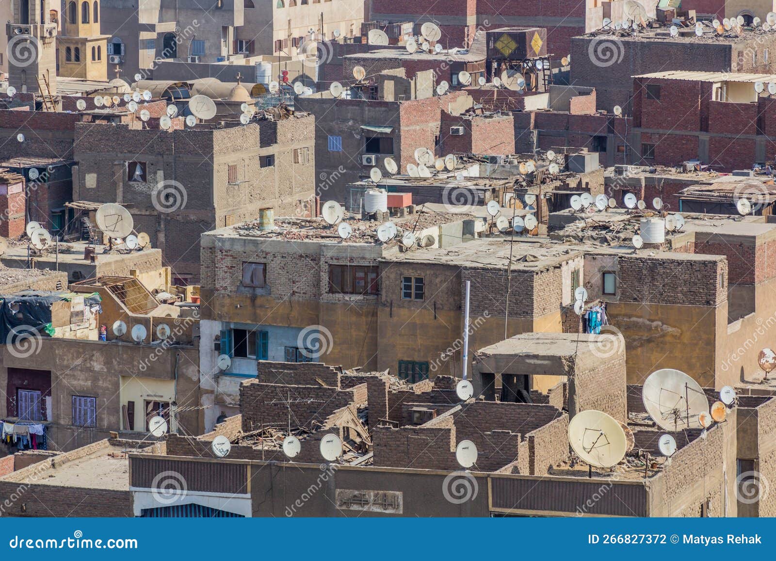 CAIRO, EGYPT - JANUARY 29, 2019: Roofs of Cairo with Satellite ...