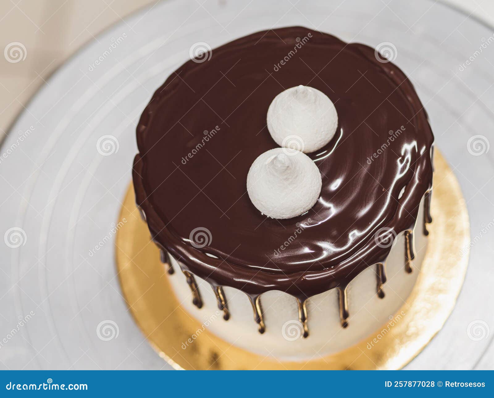 Cake Designer Decorating a Chocolate Drip Cake with Meringue and ...