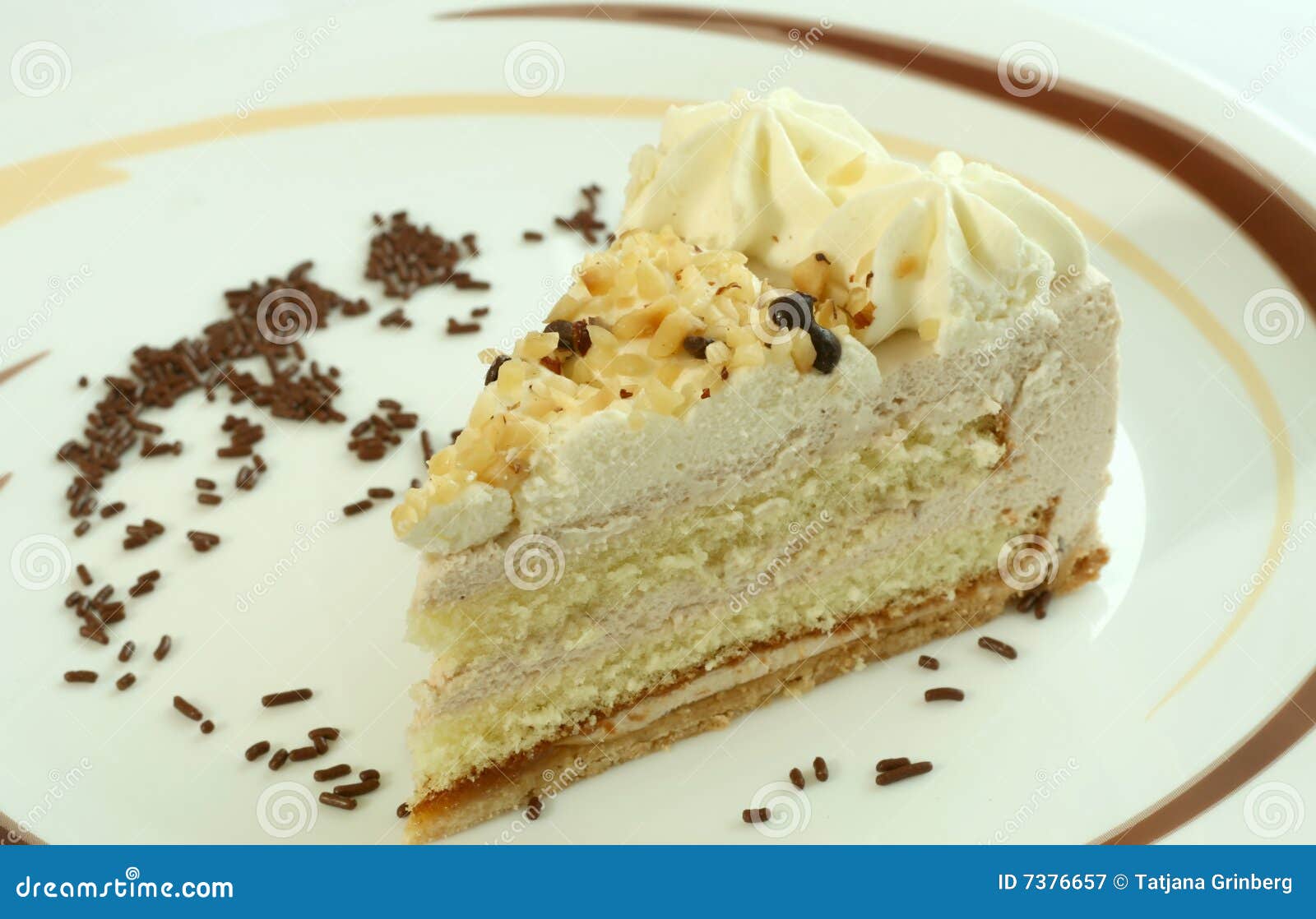 Cake with Nuts, Chocolate and Cream on a White Pla Stock Image - Image ...