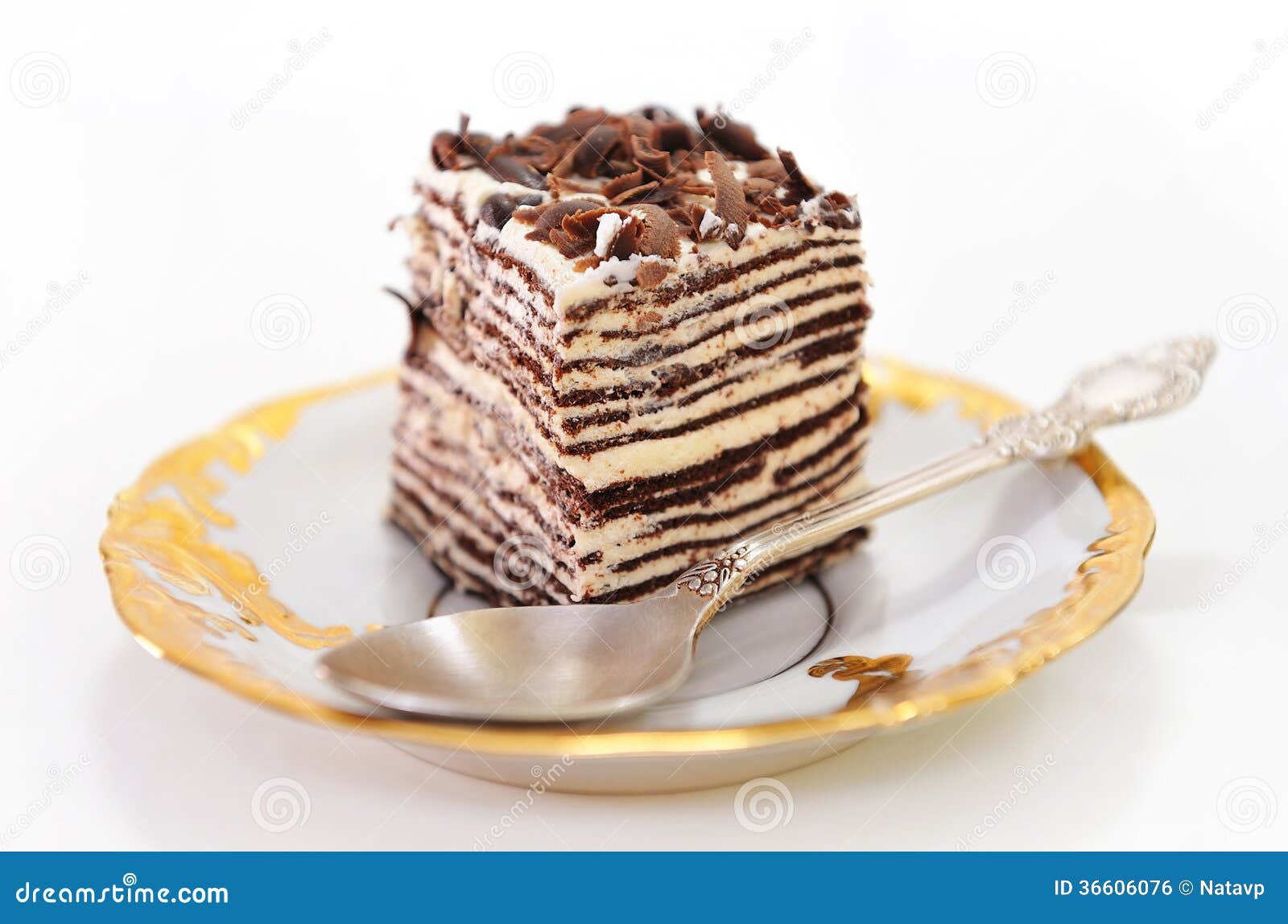 Cake with Spoon on Golden Saucer Isolated on White.. Stock Photo ...