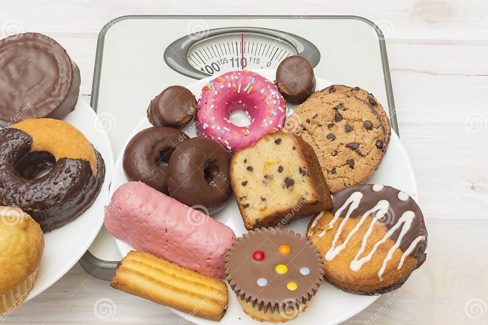 Cakes on bathroom scale stock image. Image of weighing - 73226369