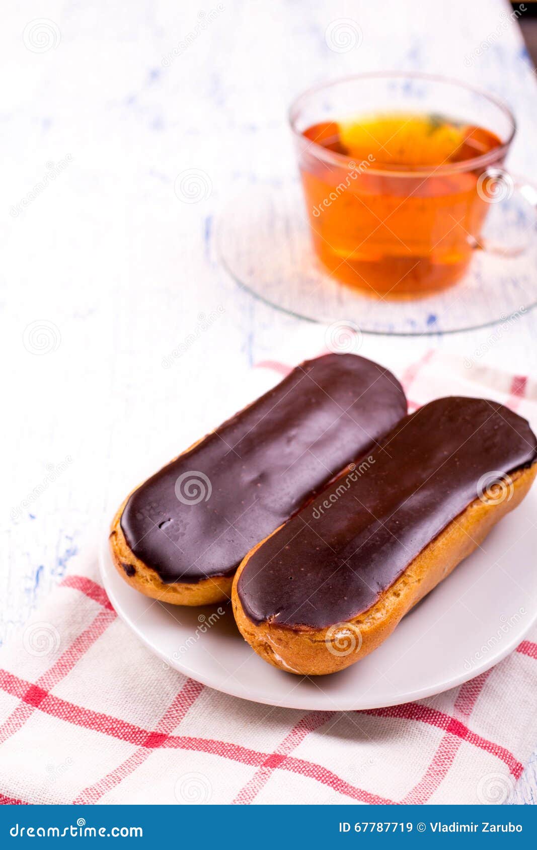 Cakes Eclairs, and a Cup of Tea with Cinnamon Stock Image - Image of ...
