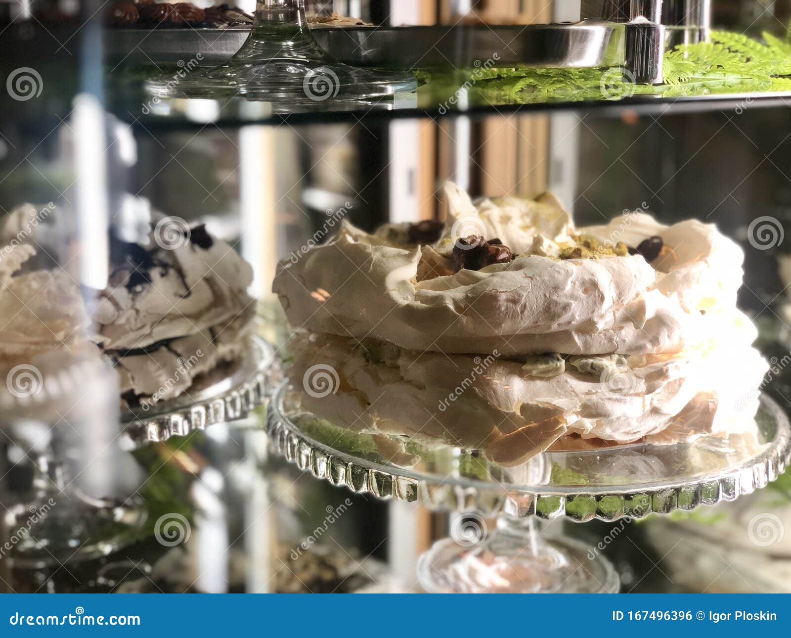 Cakes in a showcase stock photo. Image of cakes, chocolate - 167496396