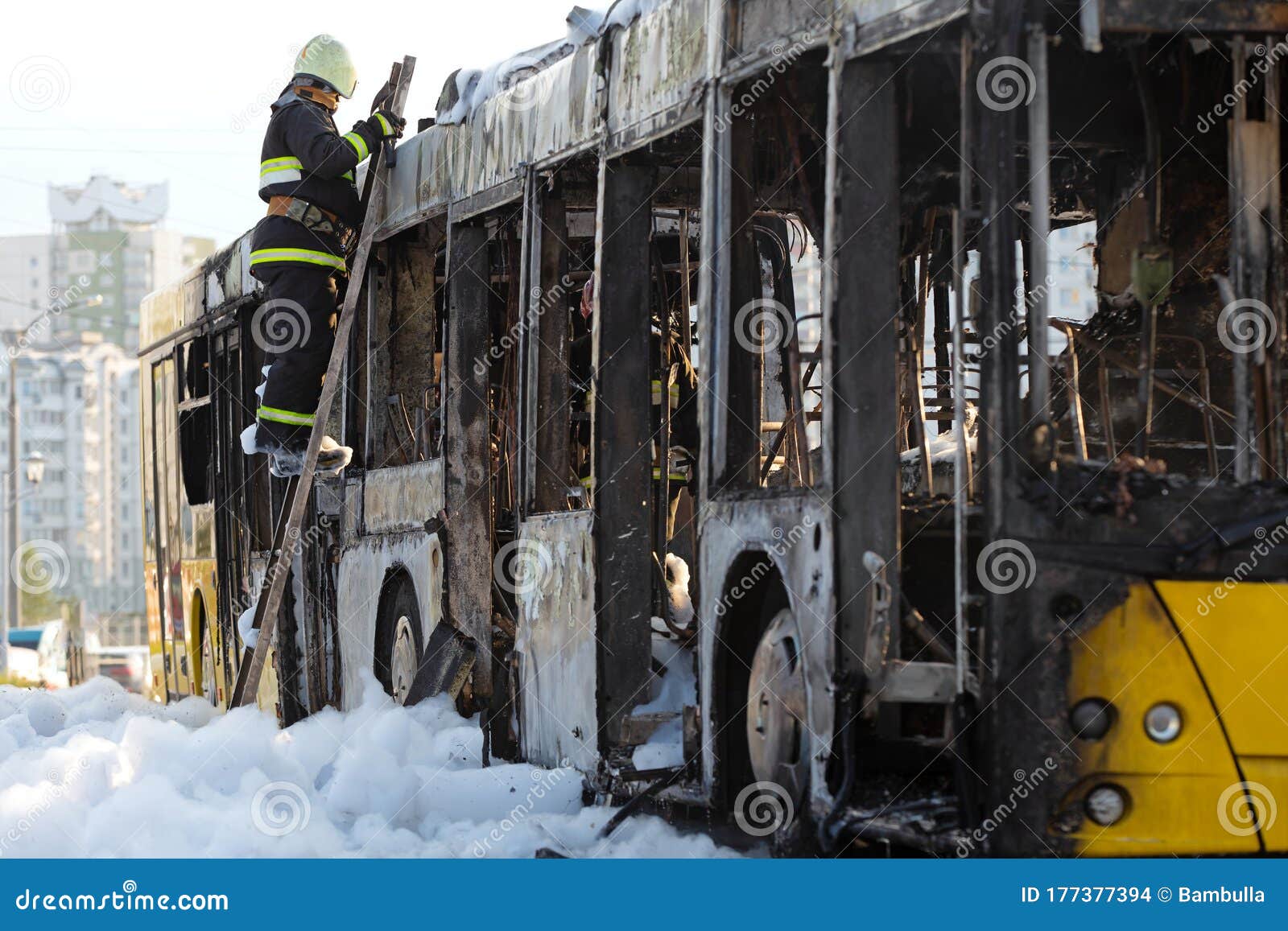 Cal Fire Firefighter Climbs a Ladder by Burnt Traffic Bus Stock Photo ...