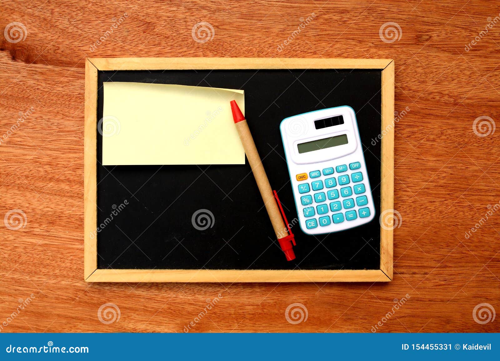 Calculator on blackboard stock image. Image of school - 154455331