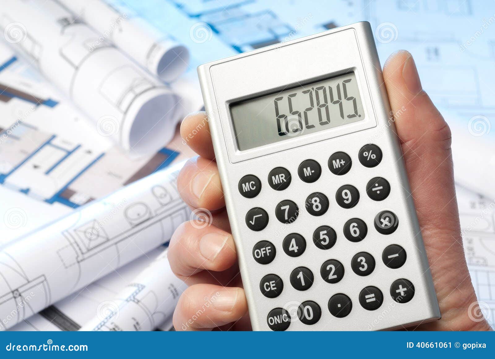 Calculator and blueprints stock image. Image of property - 40661061