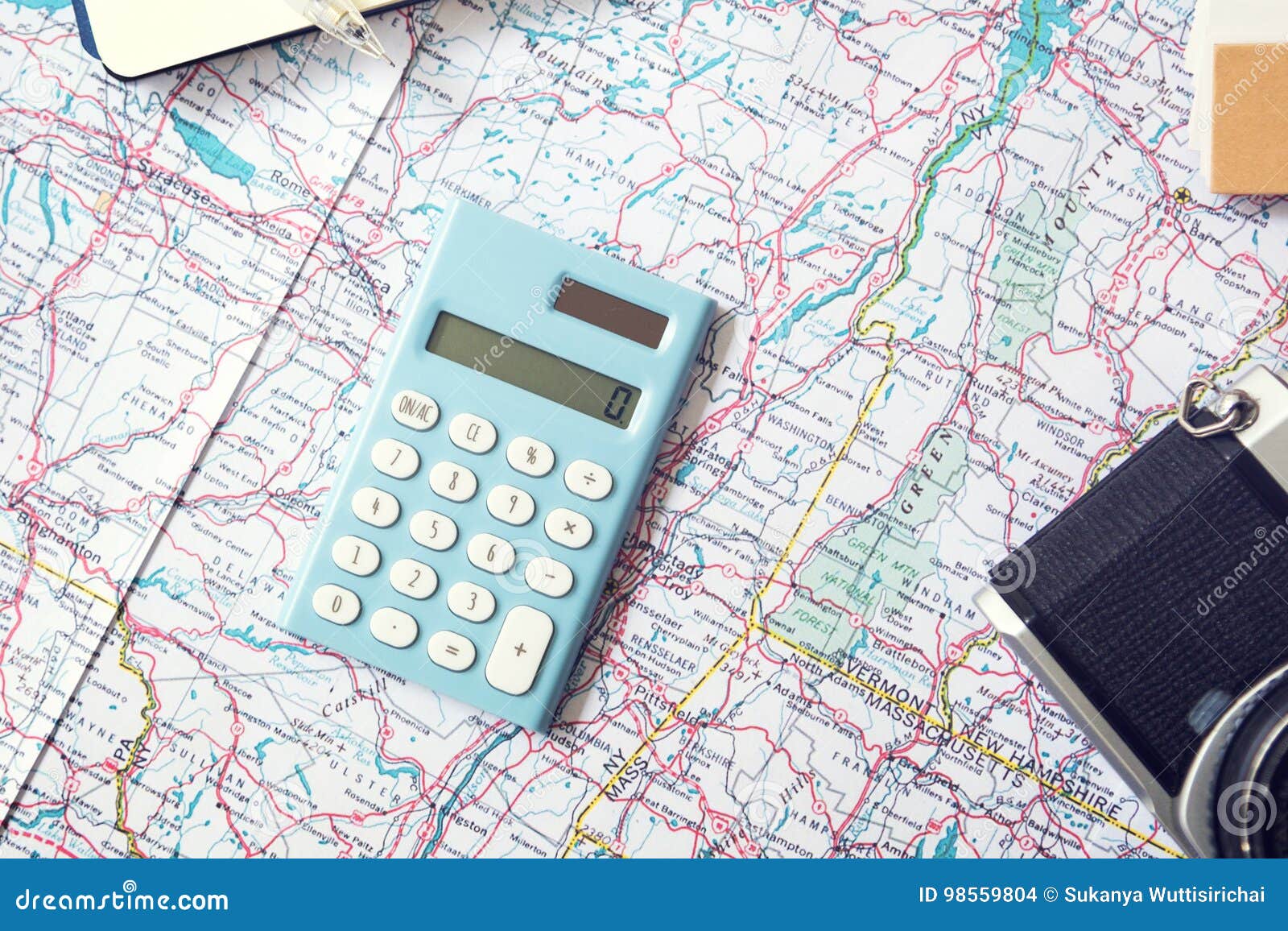 Calculator with Camera on Map Stock Photo - Image of calculate, paper ...