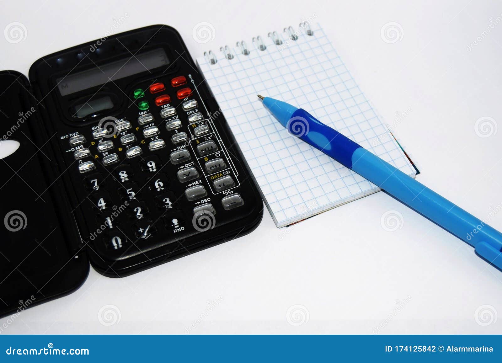 Calculator for Counting Examples in a Notebook with a Blue Pen on a ...