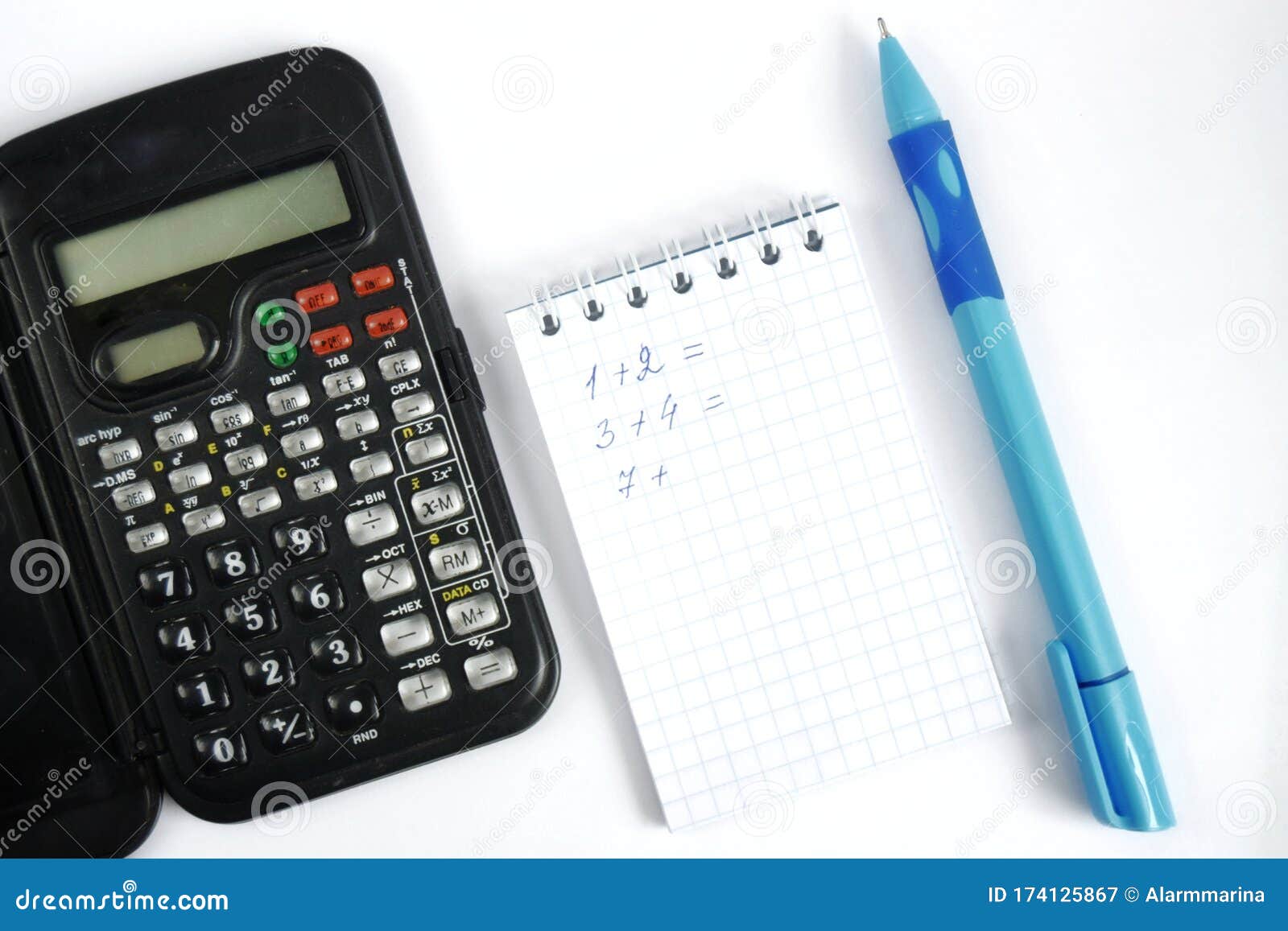 Calculator for Counting Examples in a Notebook with a Blue Pen on a ...