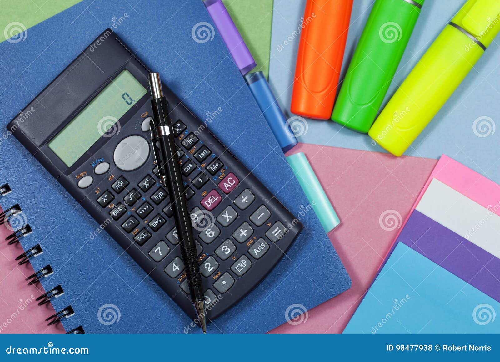 Calculator and Highlighter Pens with a Note Book Stock Photo - Image of ...