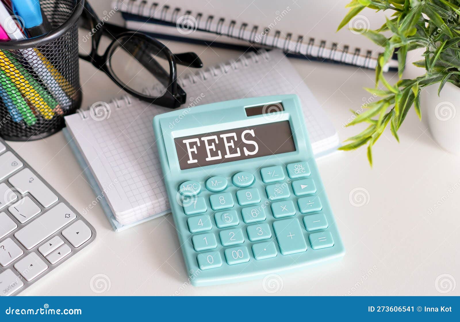 A Calculator with the Inscription FEES is Placed in the Stack of ...