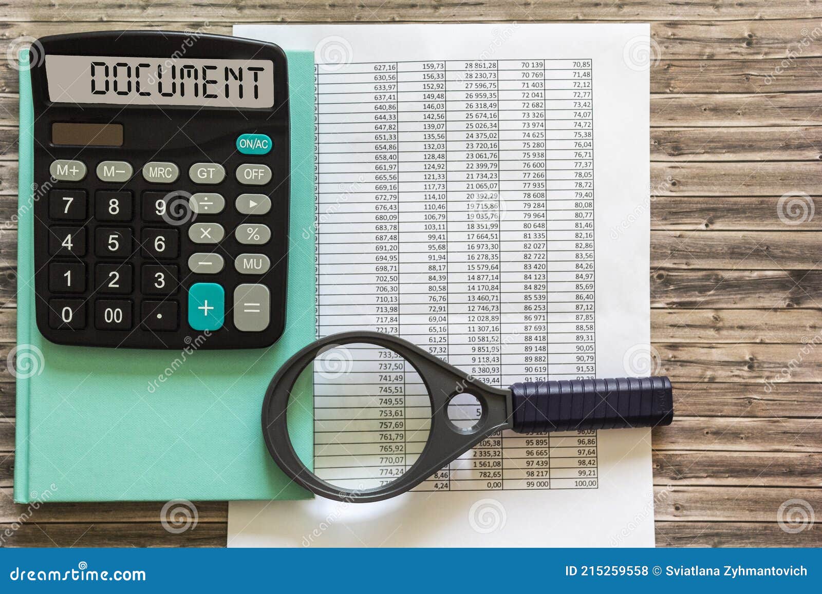 A Calculator Labeled DOCUMENT Lies on Financial Documents in the Office ...