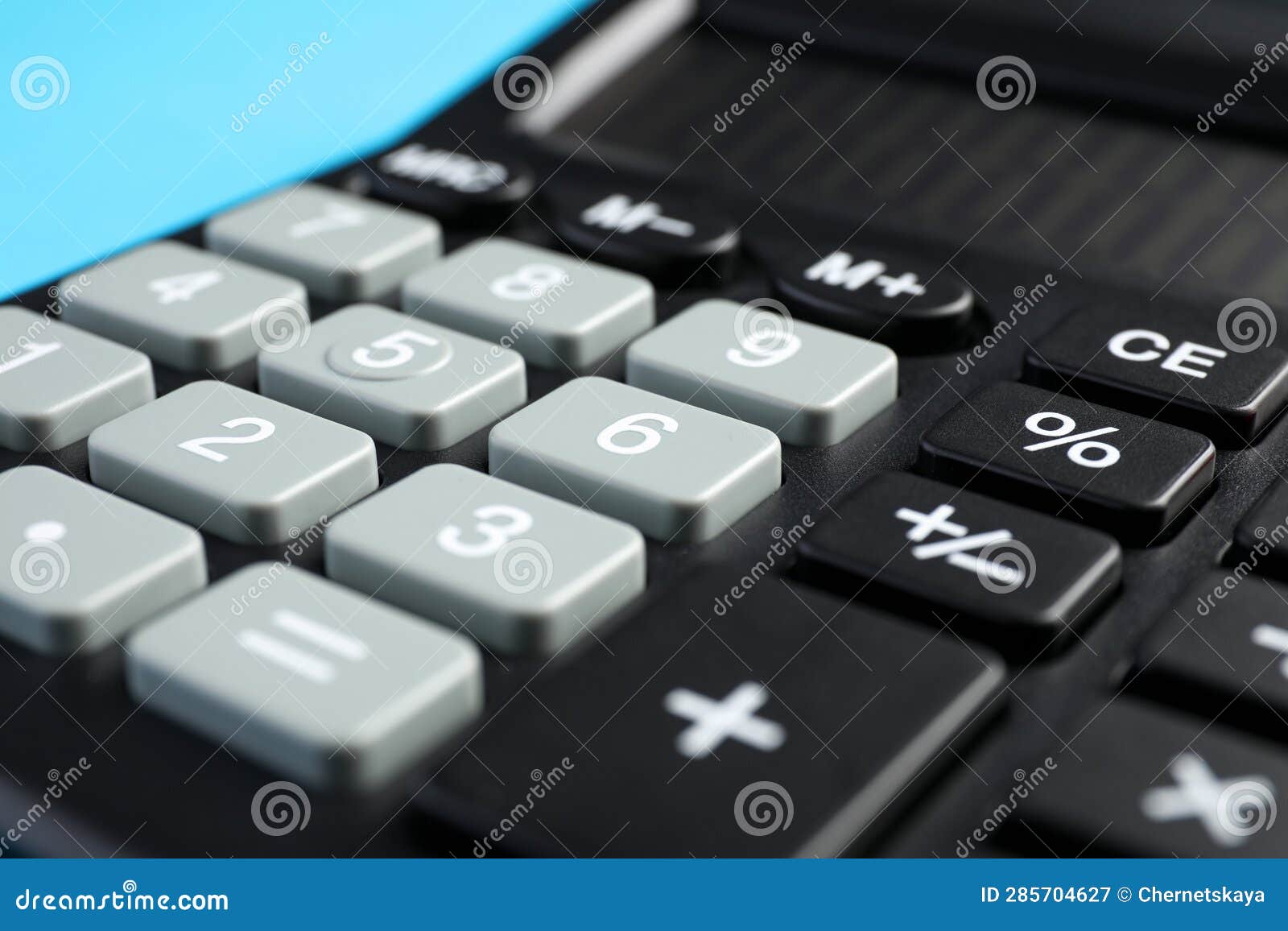 Calculator on Light Blue Background, Closeup. Office Equipment Stock ...
