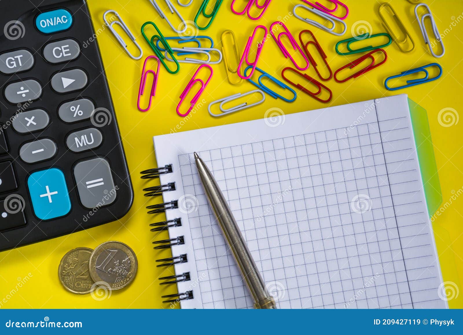 Calculator, Notebook and Pen on a Yellow Surface Stock Image - Image of ...