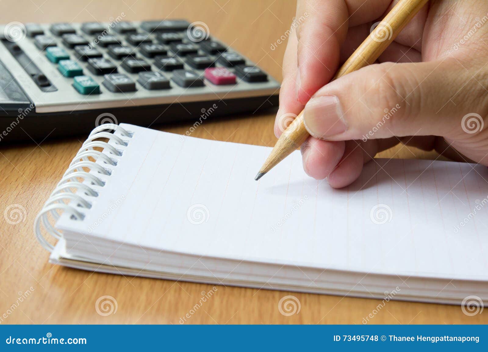 Calculator, Notebook and Pencil in Hand for Calculate Stock Photo ...