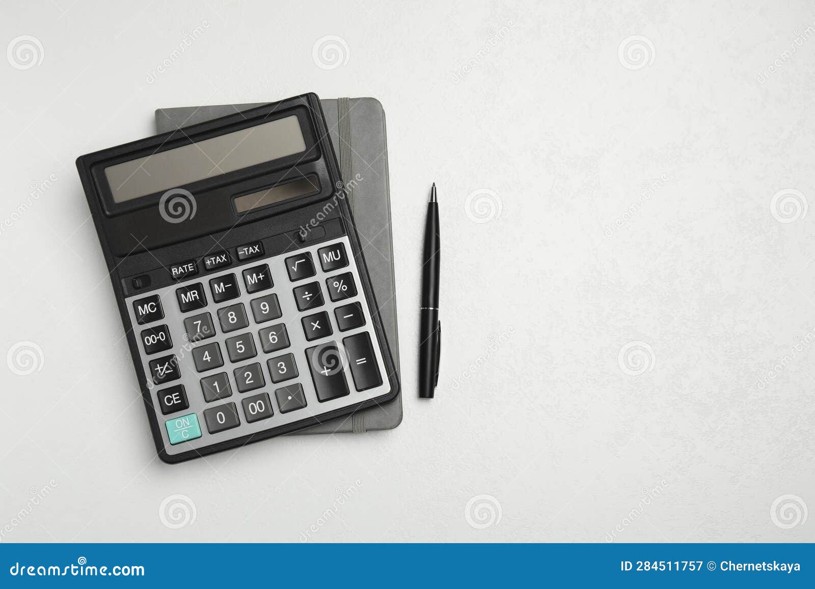Calculator and Office Stationery on White Table, Top View. Space for ...