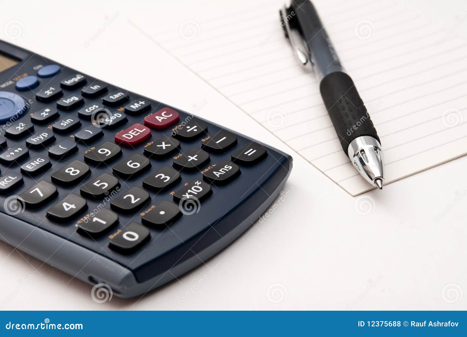 Calculator, pen and paper stock photo. Image of electronics - 12375688