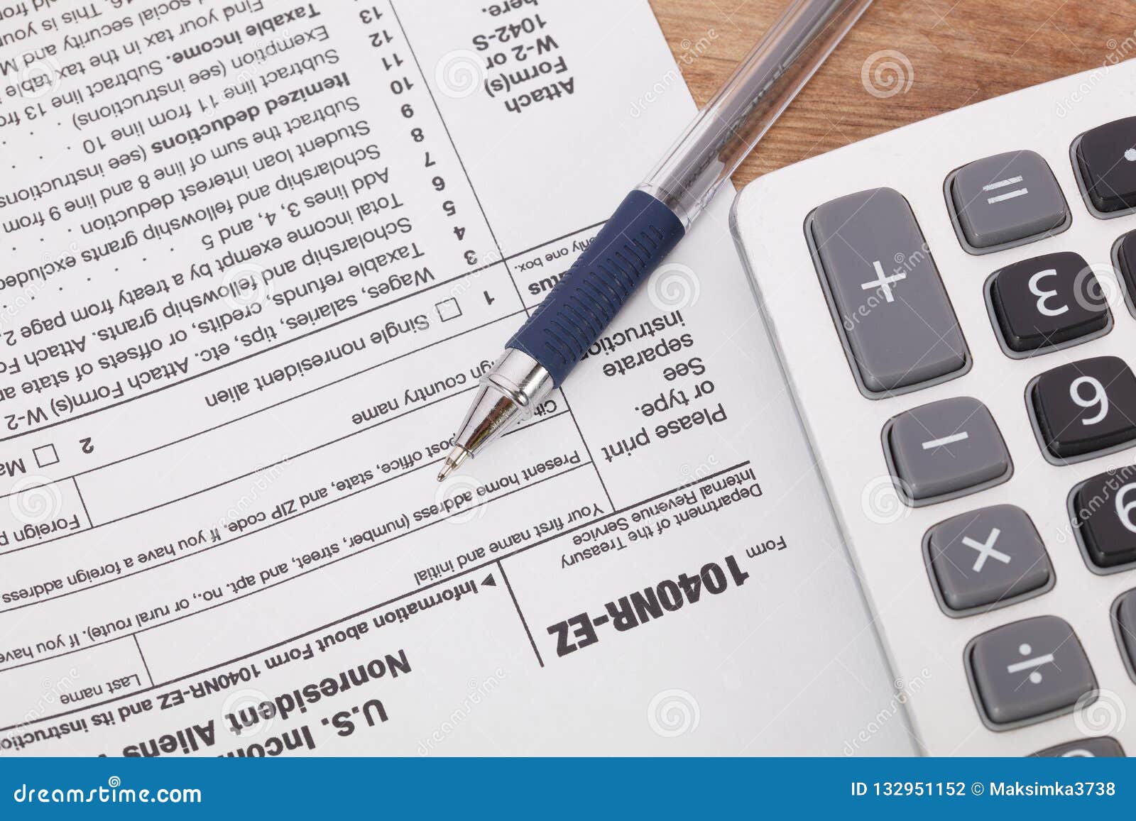 Calculator and Pen on Tax Form Background. Editorial Photography ...