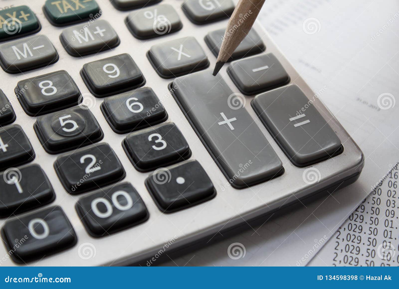 Calculator and pencil. stock photo. Image of computer - 134598398