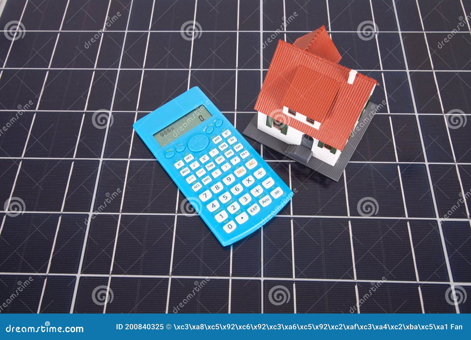 Calculator and Small House Model on Solar Panel Background Stock Image ...
