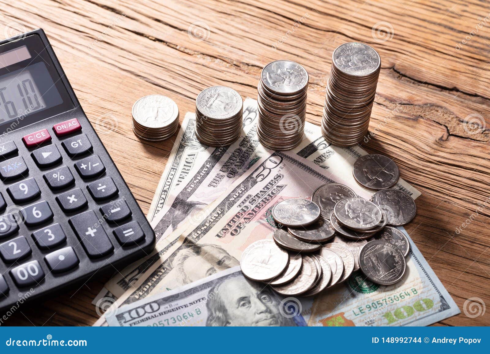 Calculator with Stacked of Coins on Table Stock Photo - Image of 401k ...