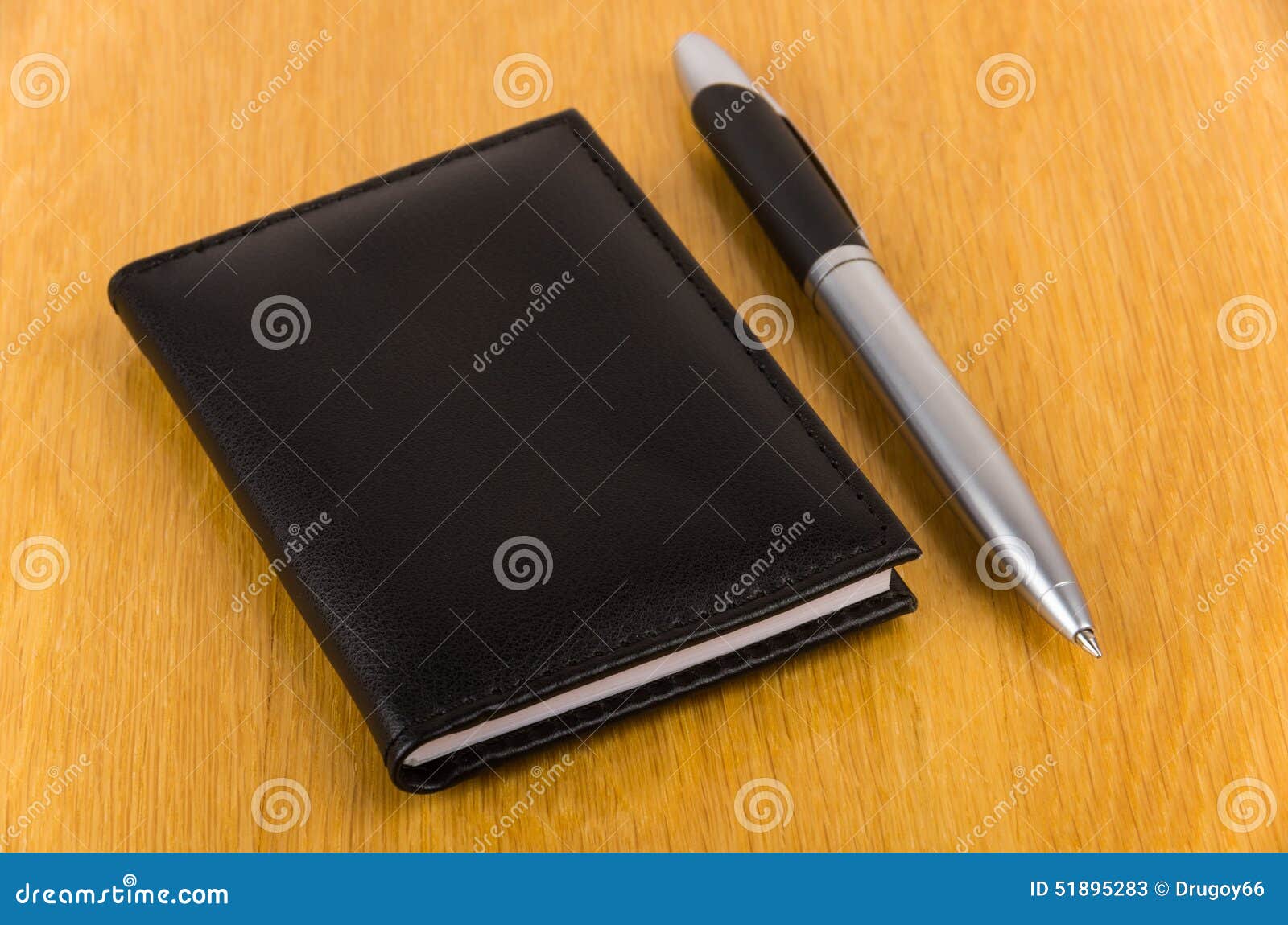 Notepad and pen on table stock image. Image of office - 51895283