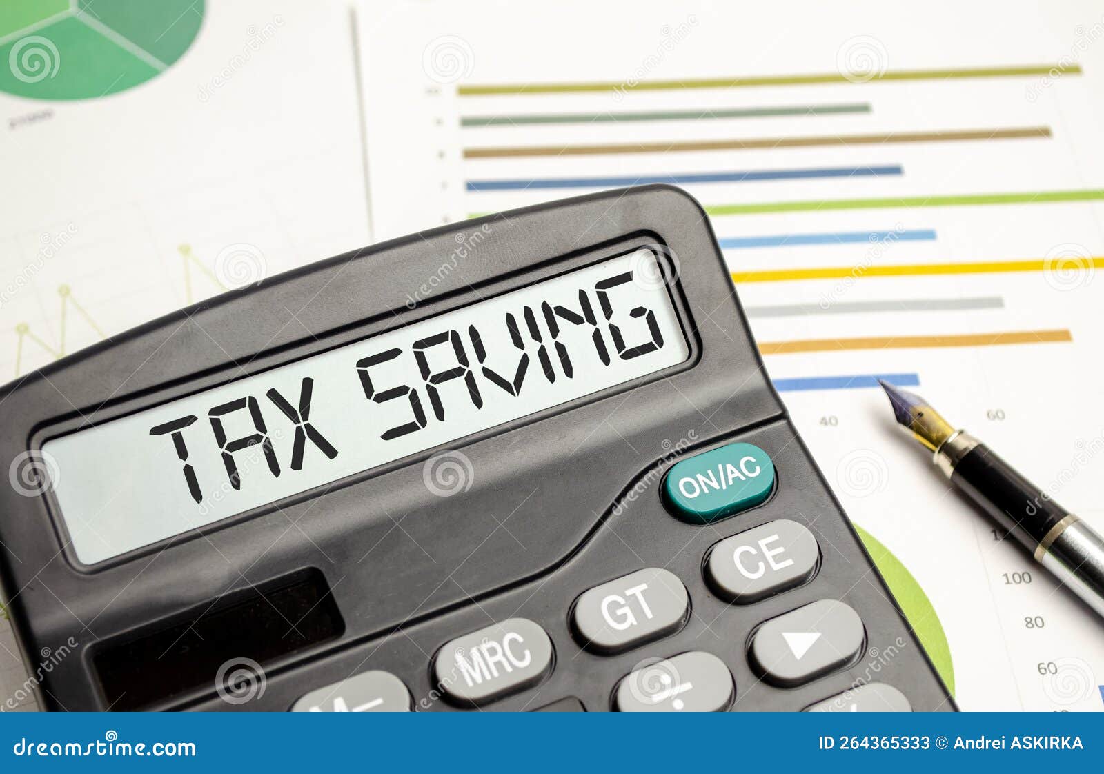 Calculator with Text Tax Saving. on Charts with Pen Stock Image - Image ...
