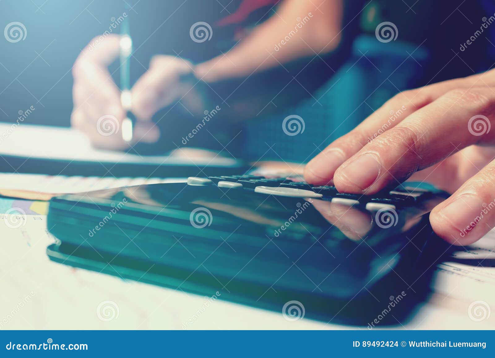 Calculator with Woman Hand Typing and Writing Make Note Stock Photo ...